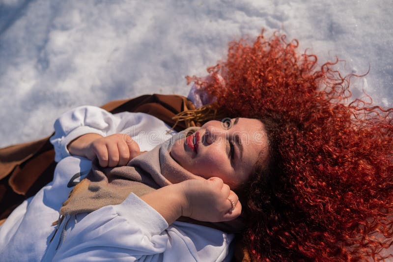 Top View of a Fat Red-haired Woman Lying on the Snow. Stock Image ...