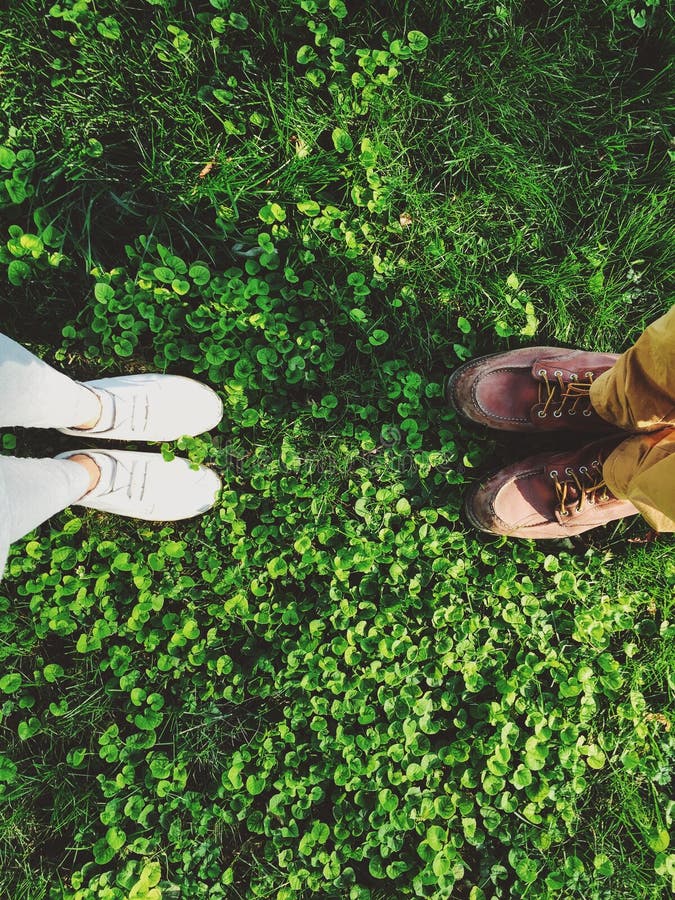 Top View Of Feet Of Young Couple On Pavement With Chalk Drawing By Kids ...