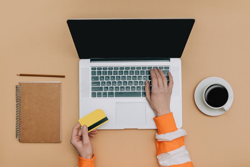 Female Customer Hands with Card and Laptop Computer Next To Notebook ...