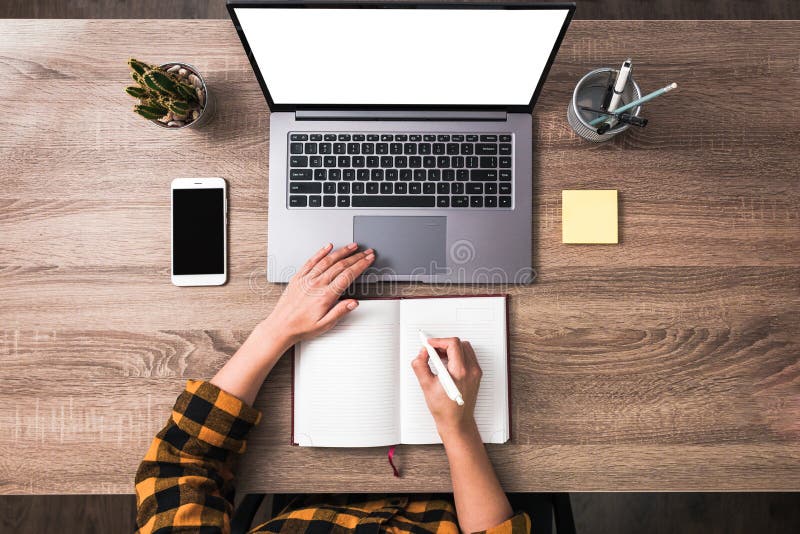 Top View Female Hands Using a Laptop and Writing in Notebook. Phone and ...