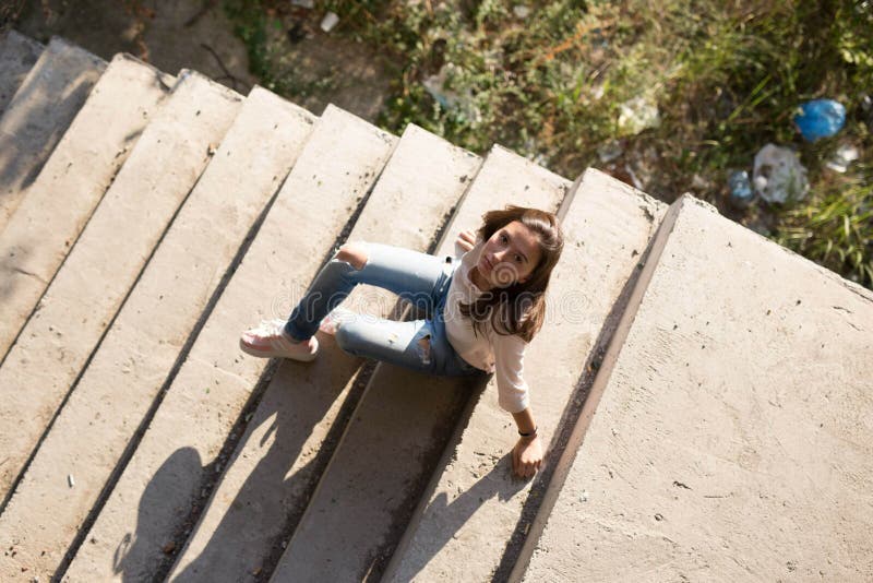 Top View Of A Female Posing Sitting On The Stairs Stock Photo - Image ...