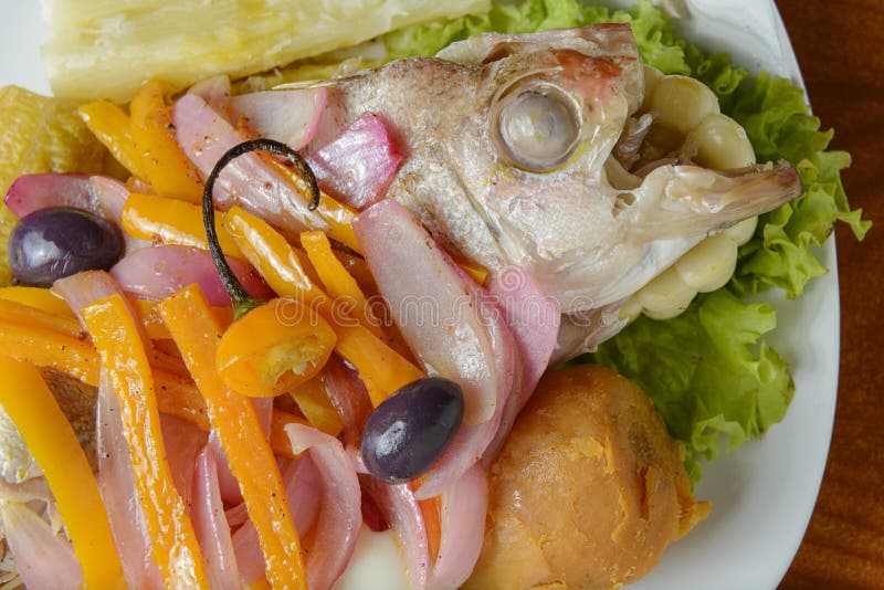 Top View of a Fish Dish Accompanied by Vegetable Stew on a Lettuce Leaf ...