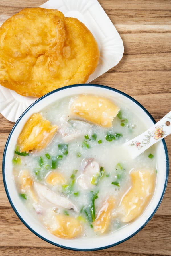 Fish Porridge with Deep-fried Chinese Donuts at Vertical Composition ...