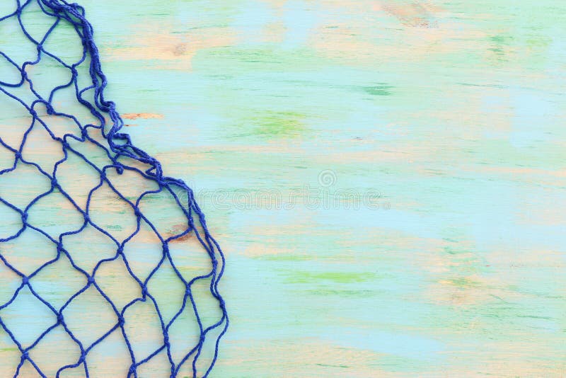 Top View of Fishnet on Pastel Blue Wooden Background. Top View, Flat ...