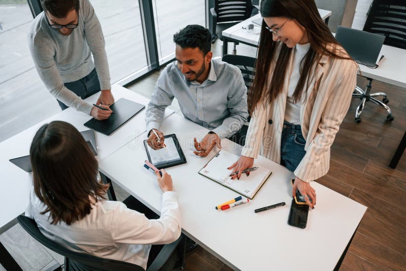 Top View. Four People are Working in the Office Together Stock Photo ...