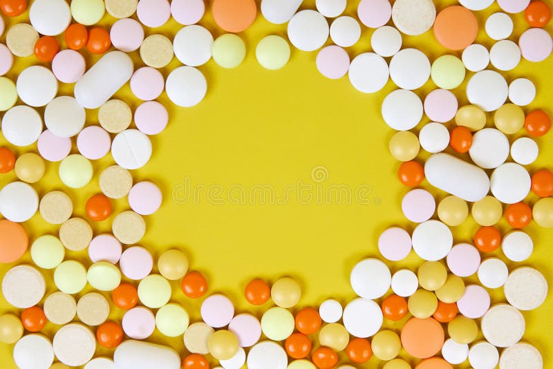 Top View of a Frame of Various Colorful Tablets on a Yellow Surface ...