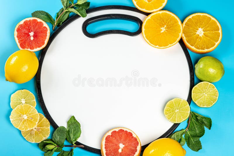 Top View, Frame with Fresh Citrus Fruits with Mint on Blue Background ...