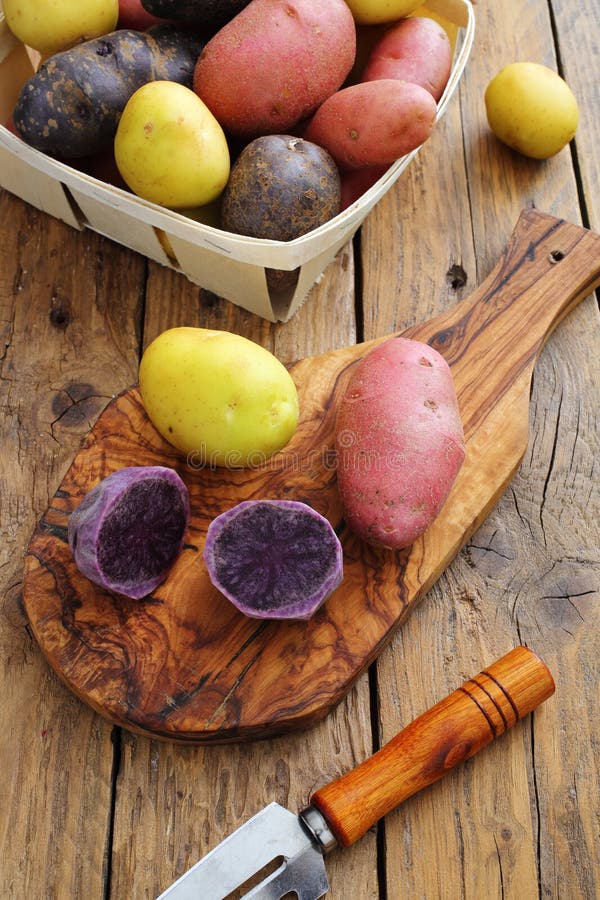 Fresh Colorfull Potatoes on Rustic Table Background Stock Image - Image ...