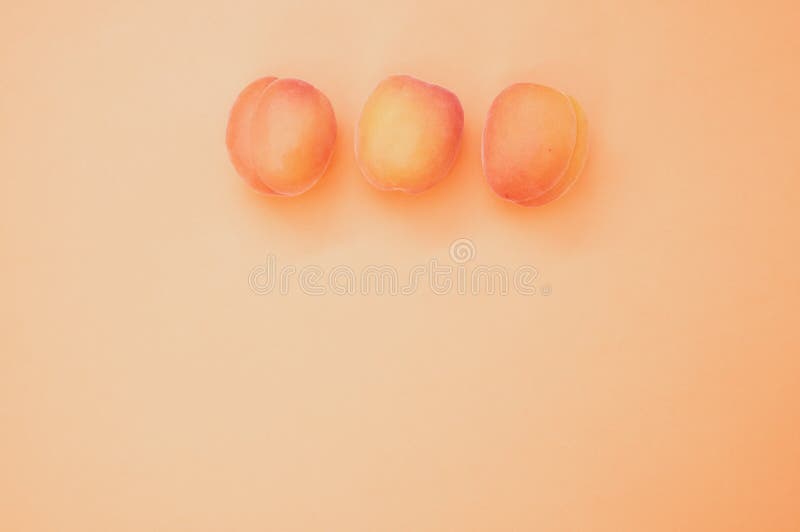Top View of Fresh Three Apricots Isolated on Pastel Peach Background ...
