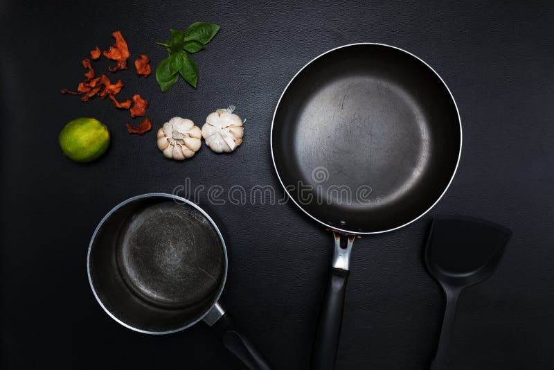 Top View Frying Pan and Pot on Black Table. Stock Image - Image of ...
