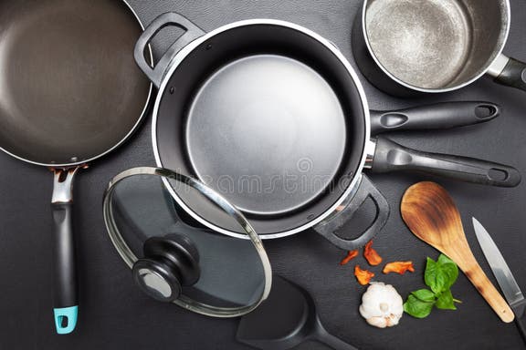 Top View Frying Pan and Pot on Black Table. Stock Photo - Image of ...