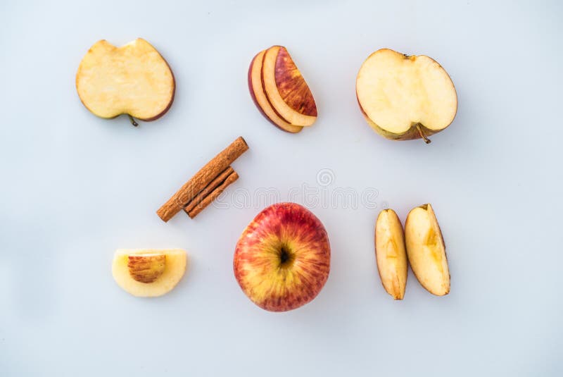 Top View of Full and Cut Apple Pieces and Cinnamon on White Background ...