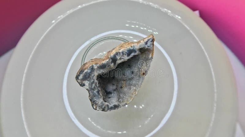 Top View of a Geode Crystal on a Glass Post on a Rotating Table with ...