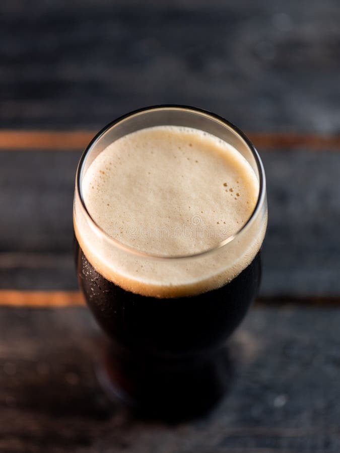 Top View a Glass of Porter Beer on a Dark Pub Table Stock Photo - Image ...