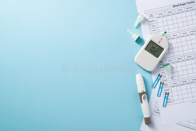 Top View of Glucometer, Lancet Pen, Strips and Blood Sugar Tracker on ...