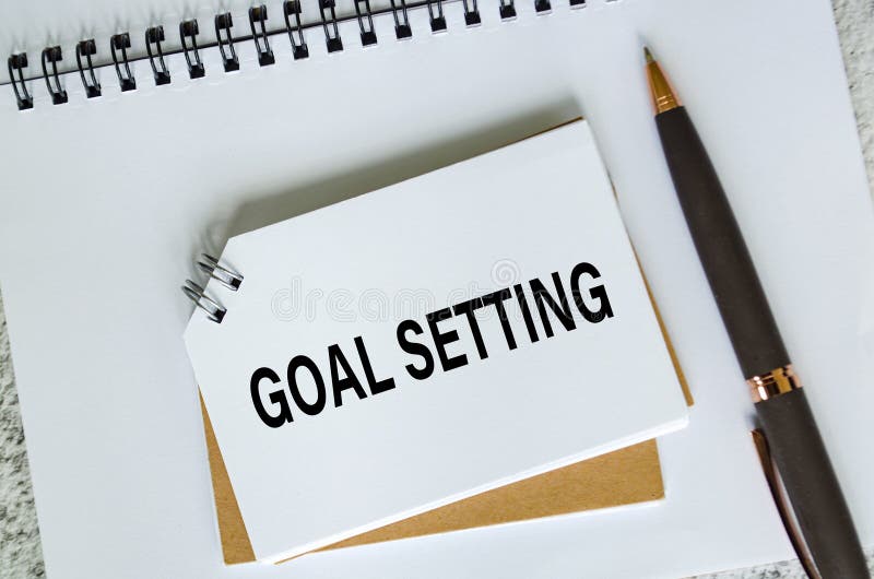 Top View of Goal Setting Text on White Notepad. Business Goal Concept ...