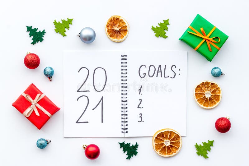 Top View of 2021 Goals List with Decorations and Notebook on a Table ...