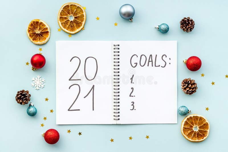 Top View of 2021 Goals List with Decorations and Notebook on a Table ...