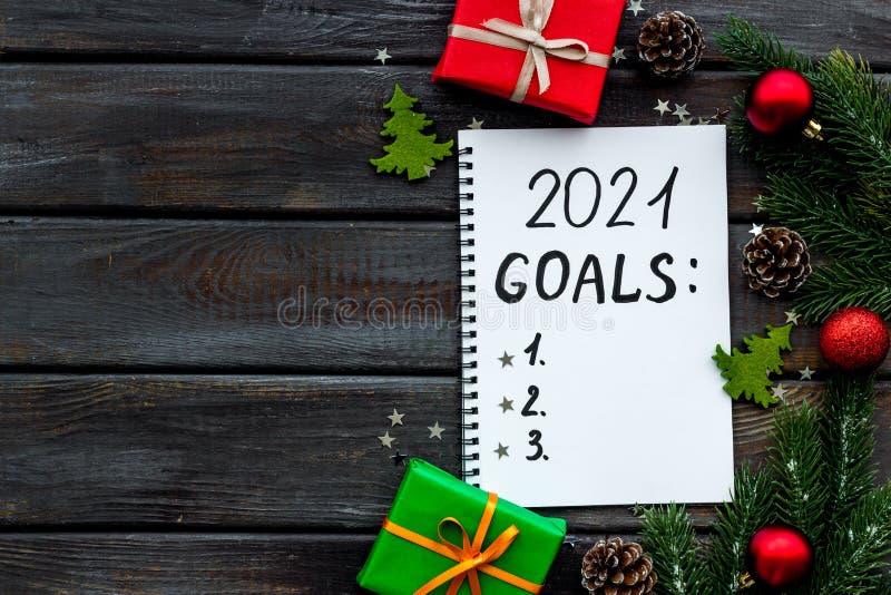 Top View of 2021 Goals List with Decorations and Notebook on a Table ...