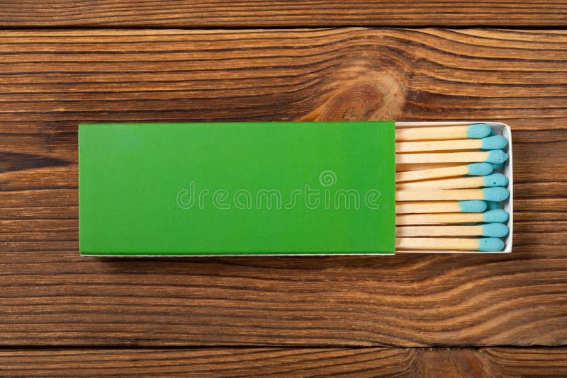 Green Color Matchbox with Green Match Sticks on a Wood Table Stock ...