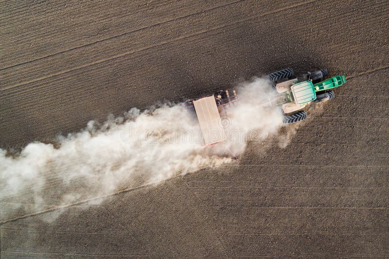 Top View of Green Tractor Working in Fields. Aerial Photo. Stock Image ...