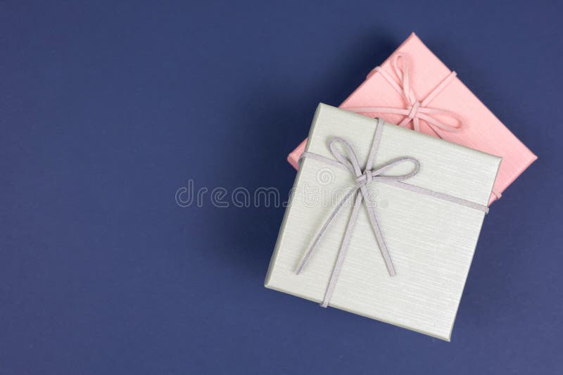 Top View, Grey Gift Box Stack on Pink Gift Box Over Dark Blue Paper ...