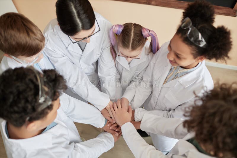 Top View at Group of Children Stacking Hands during Science Class Stock ...