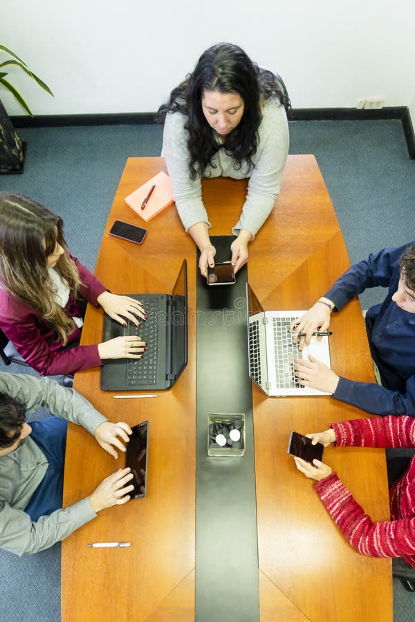 Top View of a Group of Employees Sitting Around Office Meeting Table ...