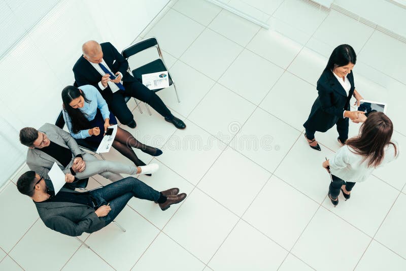 Top View. a Group of Employees Using Their Devices in the Workplace ...