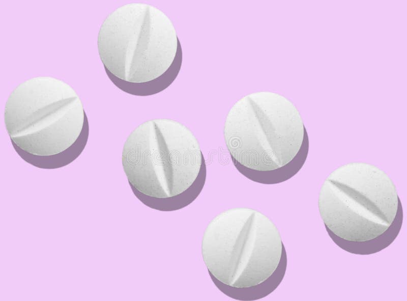 Top View of a Group of Six Pills on a Pink Background Stock Photo ...