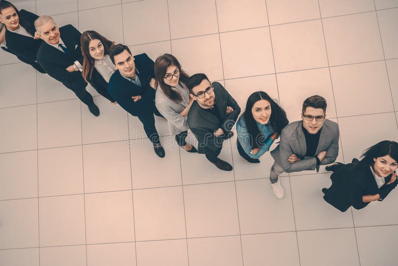 Group of Smiling Business People Standing in a Row and Looking at the ...