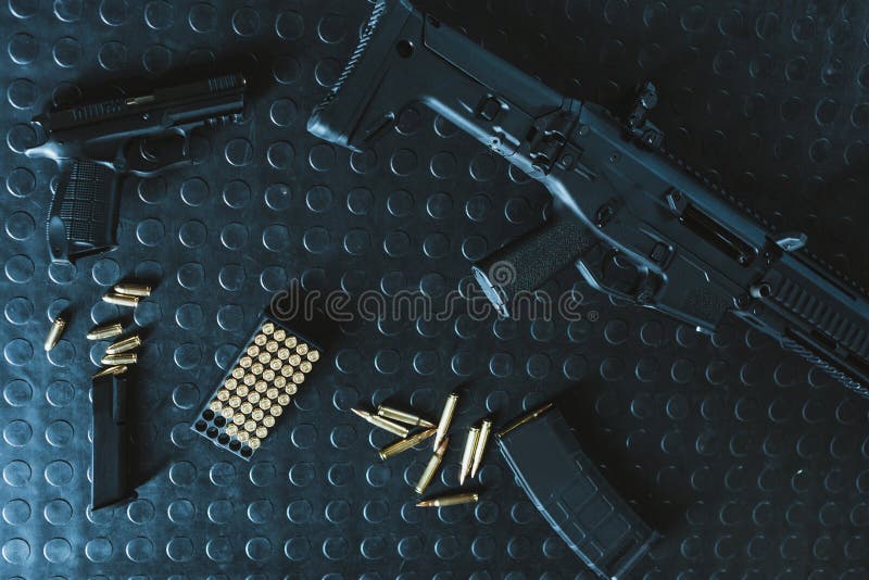 Top View of Gun and Rifle with Bullets on Table Stock Photo - Image of ...