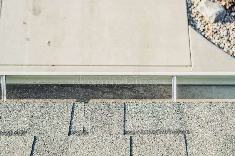 Top View of a Gutter System on a Residential House. Asphalt Shingles ...