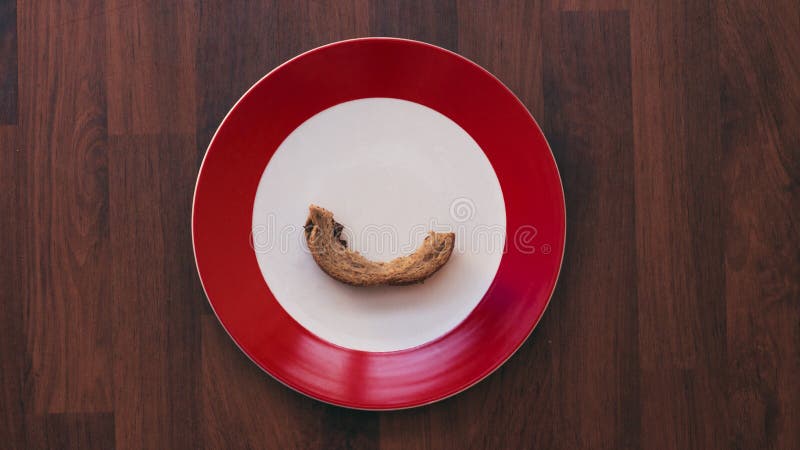 Top View of a Half-eaten Bread Crust on a Plate on a Wooden Table Stock ...