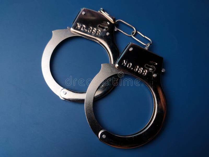 Top View Hand Cuff on a Blue Background Stock Photo - Image of symbol ...