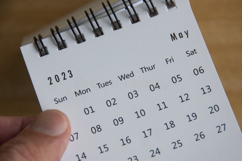 Top View of Hand Flipping May 2023 Calendar. Calendar Concept Stock ...