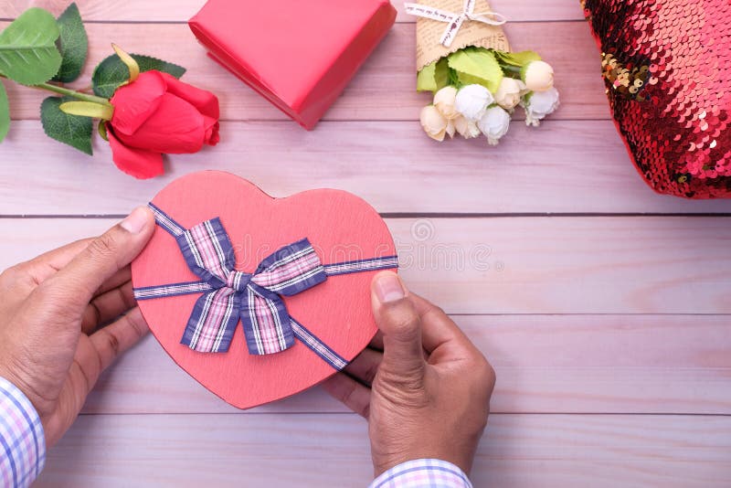 Top View of Hand Holding Heart Shape Gift Box Stock Image - Image of ...