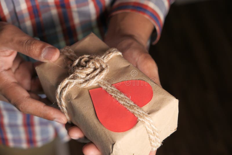 Top View of Hand Holding Heart Shape Gift Box Stock Photo - Image of ...