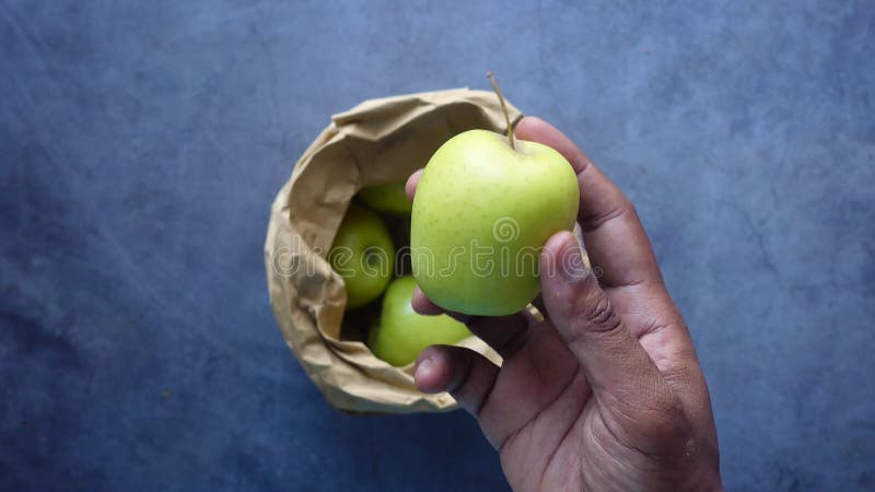Top View of Hand Pick Apples from a Packet Stock Video - Video of green ...