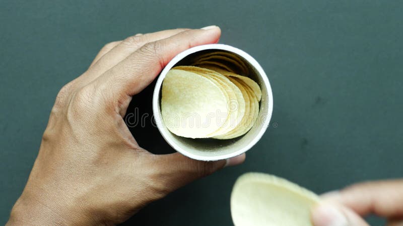 Top View of Hand Pick a Chips from a Container Stock Footage - Video of ...
