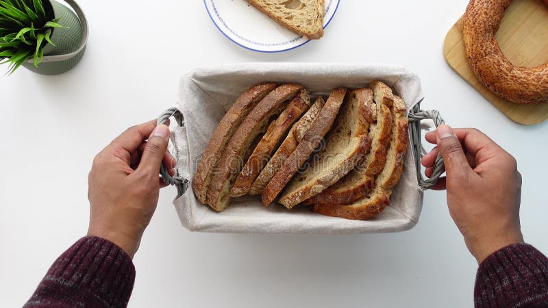 Top View of Hand Pick Wheat Multigrain Bread from a Bucket Stock Video ...