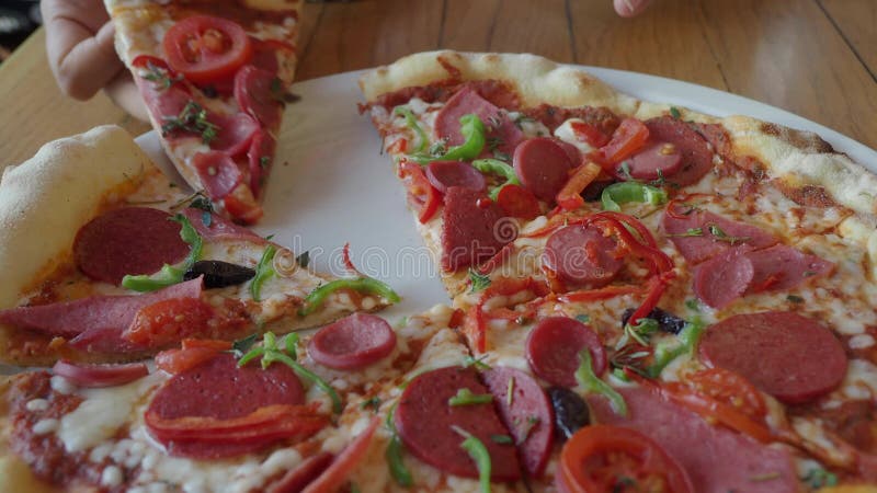 Top View of Hand Picking Slice of Pizza from a Plate Stock Footage ...