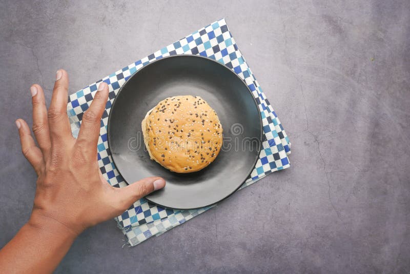 Top View of Hand Reaching for a Burger Stock Image - Image of fresh ...