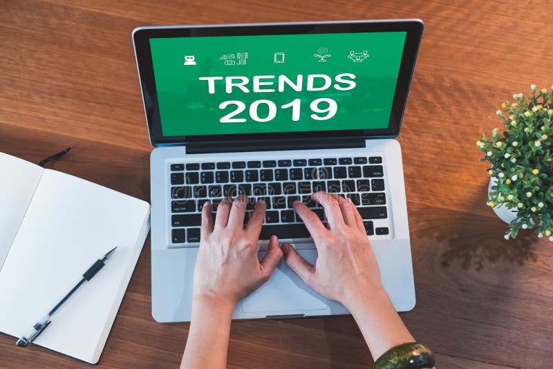 Top View Hand Type Trends 2019 on Laptop Keyboard with Open Notebook ...