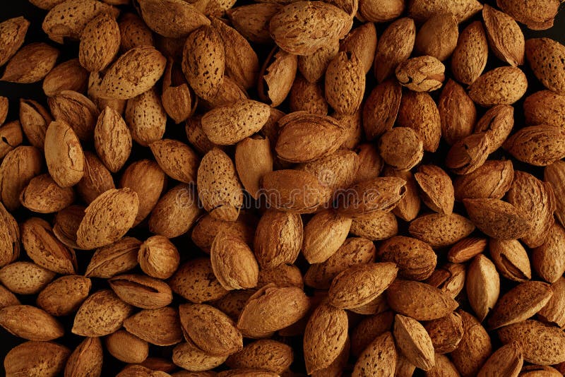 Top View of Handful of Pecans, Almonds on a Black Background. Closeup ...