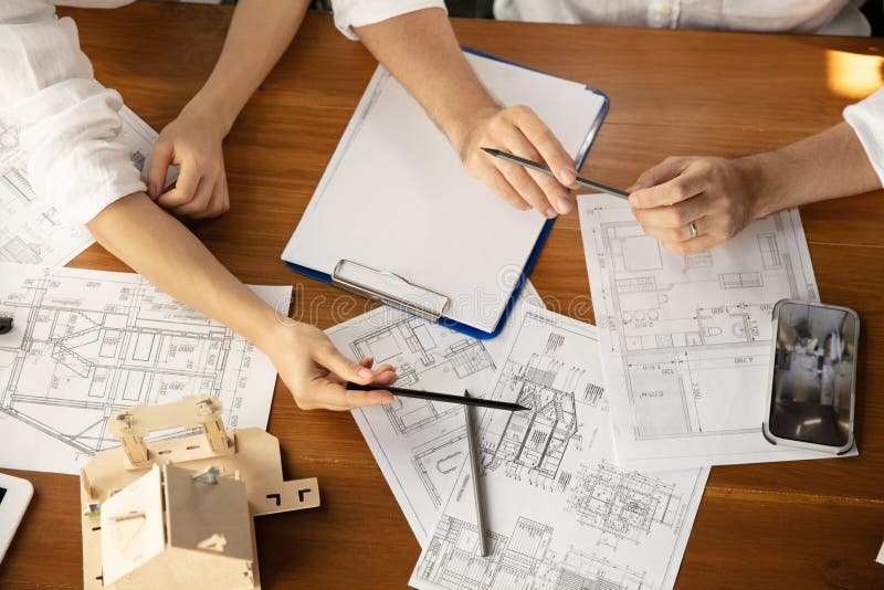 Male Architect-engineer Presents Project of Future House for Young ...