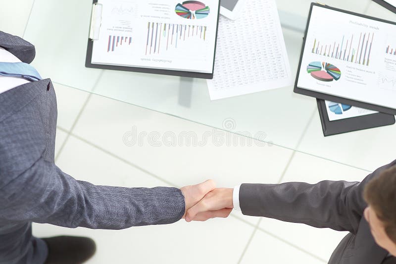 Top View.handshake of Financial Partners in the Office Stock Photo ...