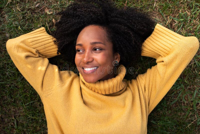 Top View of Happy Smiling African American Woman Relaxing Lying on ... Top View of Happy Smiling African American Woman Relaxing Lying on ...