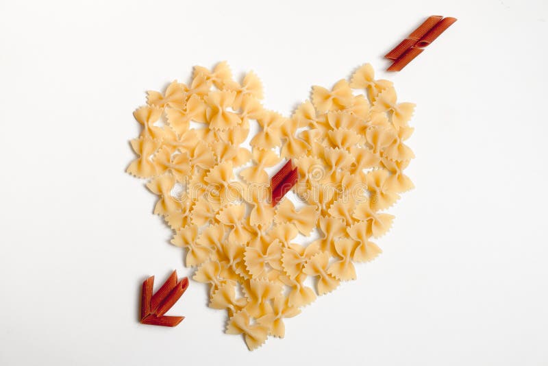 Arrow of Pasta on a Blue Background Stock Photo - Image of graphic ...