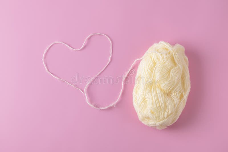 Top View of Heart Made from a Woolen Thread with Ball of Yarn on Light ...